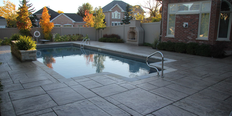Using decorative concrete to create unique swimming pool surrounds ...
